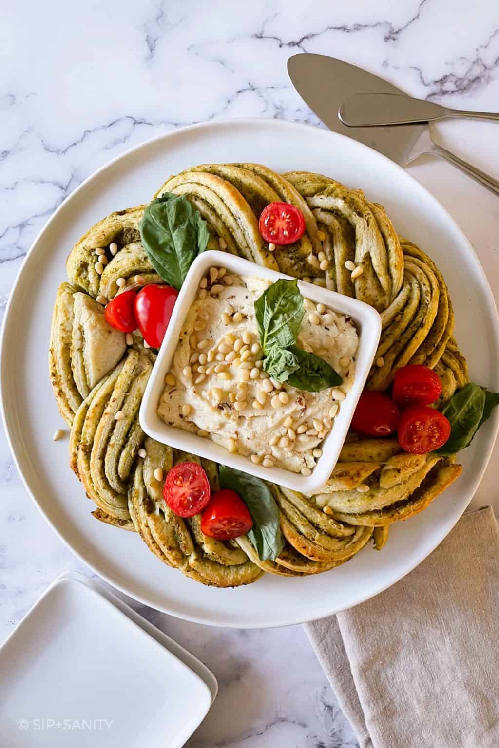 Pesto Bread Wreath + Goat Cheese Spread • Sip + Sanity
