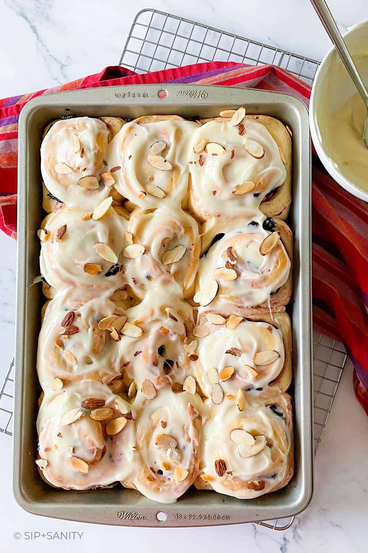 Cherry Sweet Rolls with Cream Cheese Icing + Toasted Almonds • Sip + Sanity