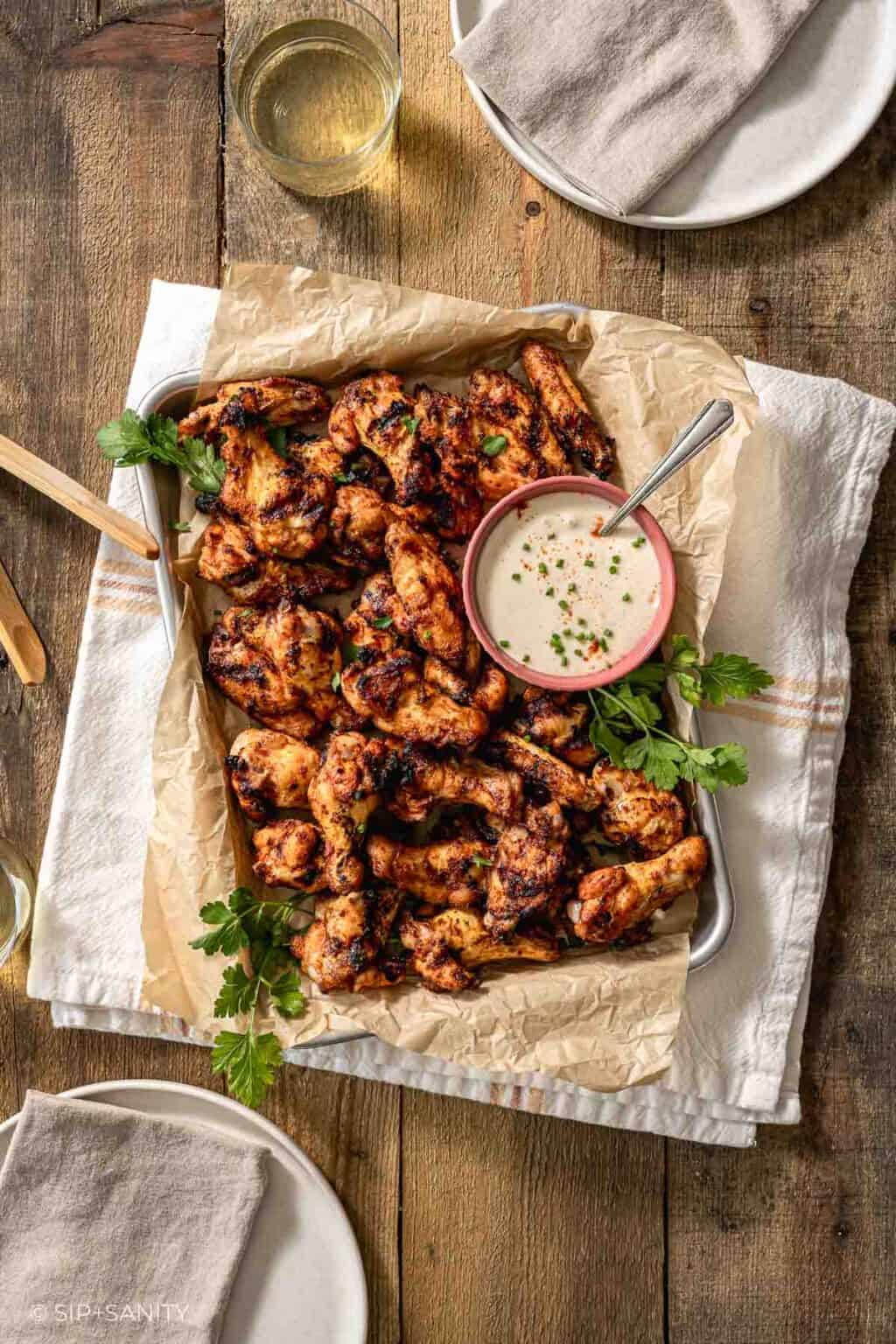 Spicy Grilled Chicken Wings with Alabama White Sauce • Sip + Sanity