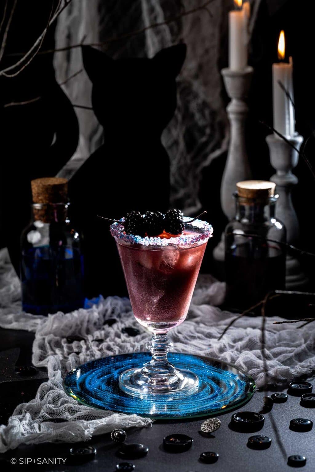 Coraline's Portal Potion (Spellbinding Halloween Cocktail) • Sip + Sanity