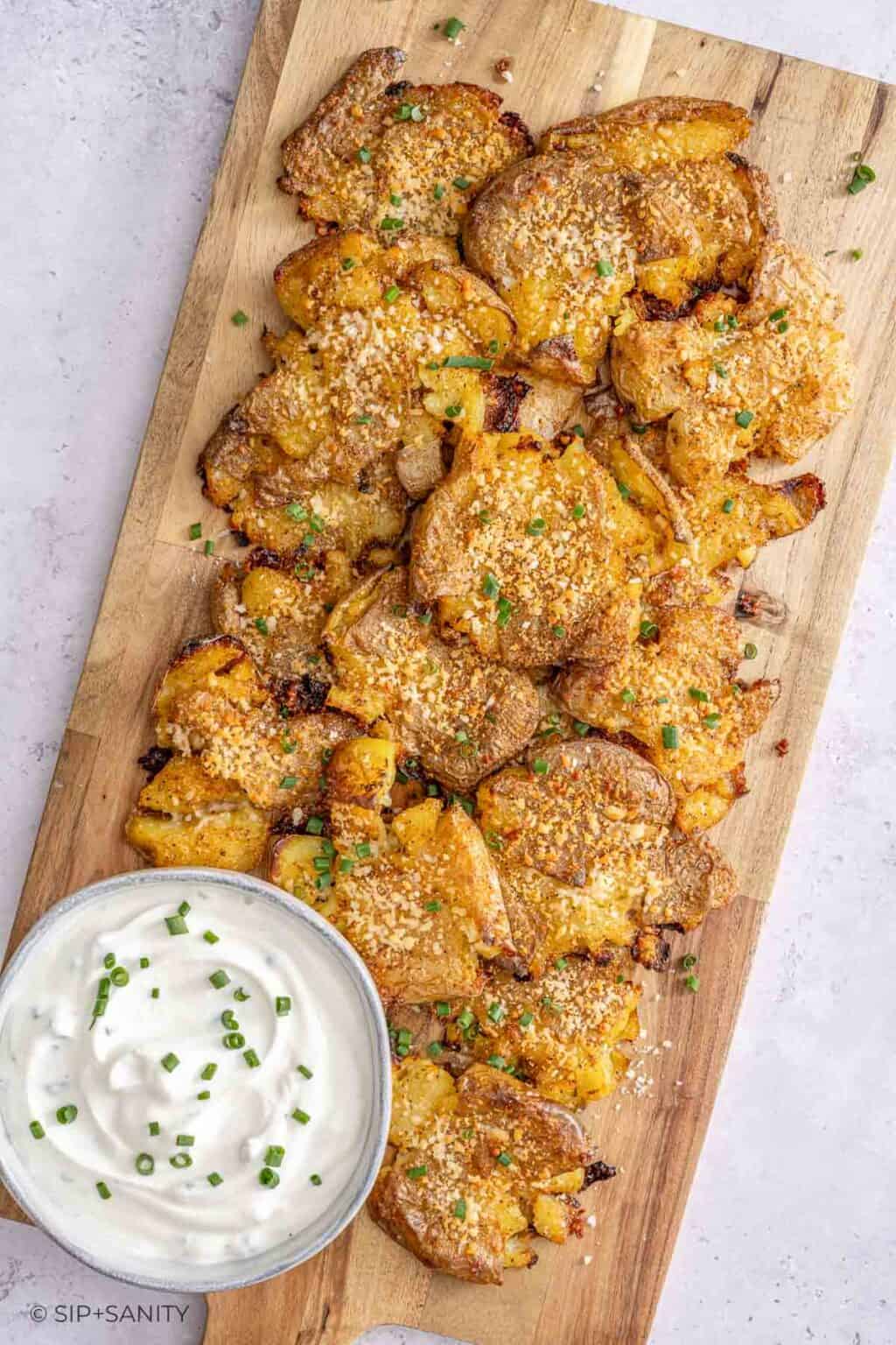 Crispy Parmesan Smashed Potatoes with Sour Cream Sauce • Sip + Sanity